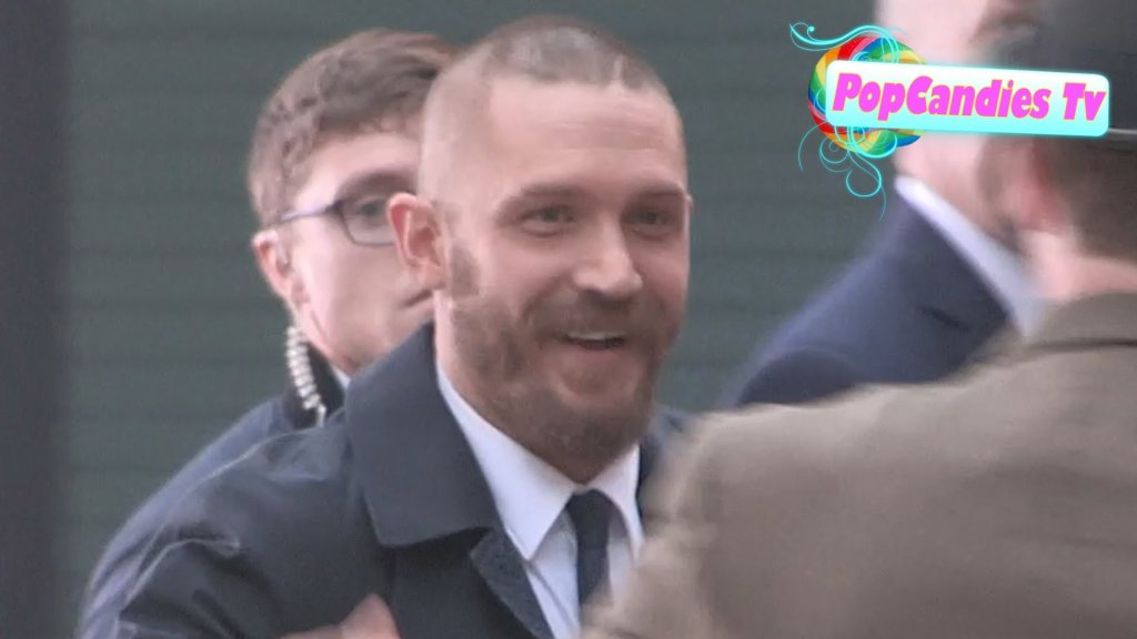 Tom Hardy connects with friends while entering Mad Max Fury Road ...